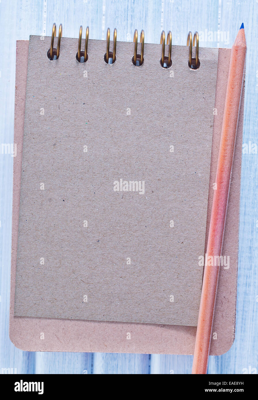 notepad on a table Stock Photo - Alamy
