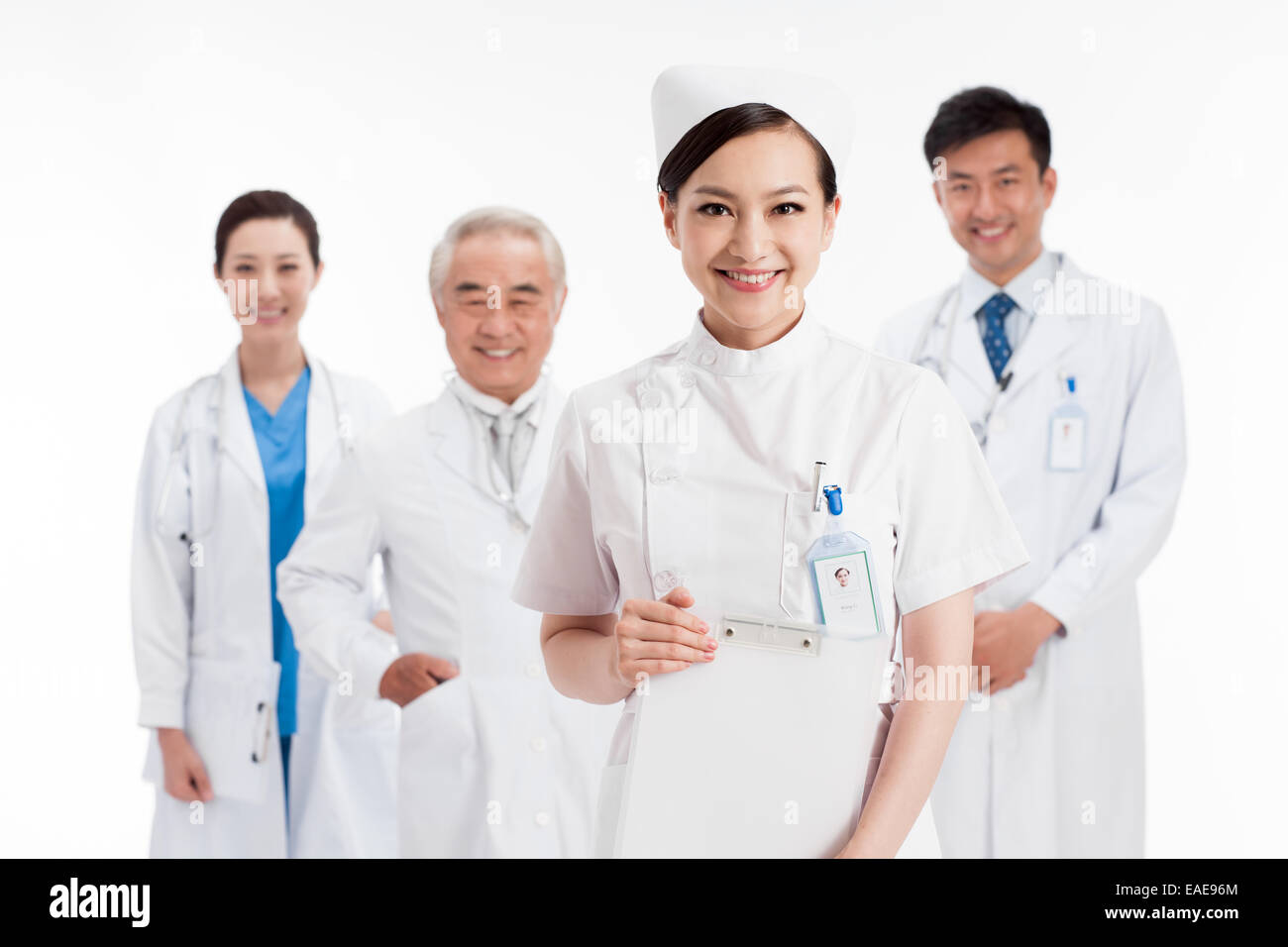 Four portrait of doctors on white background Stock Photo - Alamy