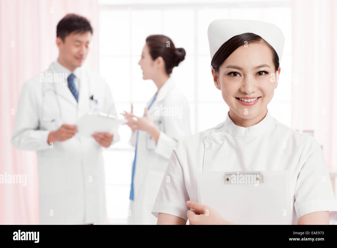 Young Oriental female nurses Stock Photo - Alamy