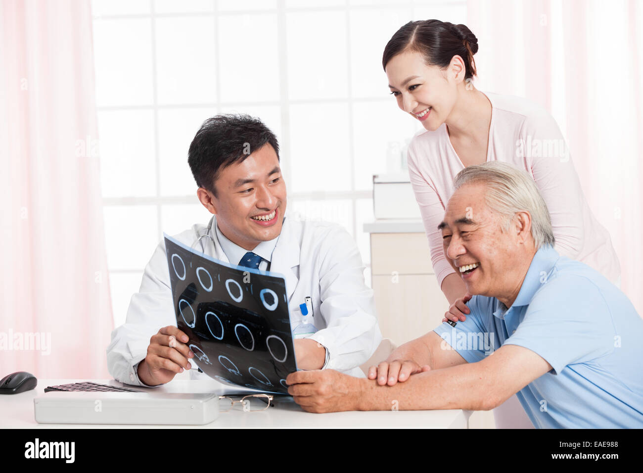 The doctor and the elderly see x-rays Stock Photo - Alamy