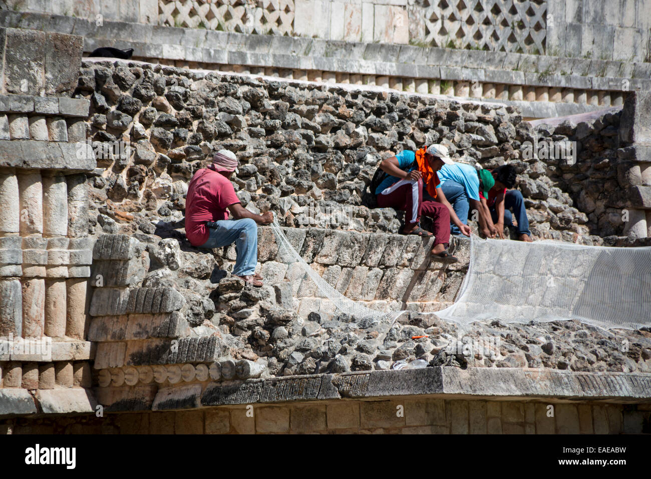 workers on a wall in a Temple of Uxmal, Mayan city, Mexico Stock Photo ...