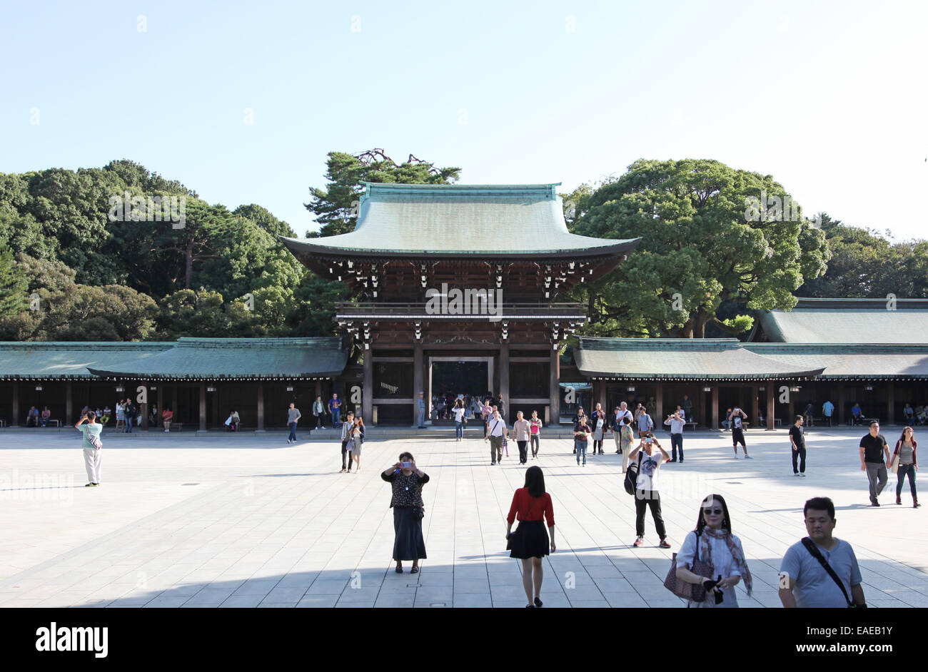 People are pictured at the Meiji Shrine in Shibuya district in Tokyo ...