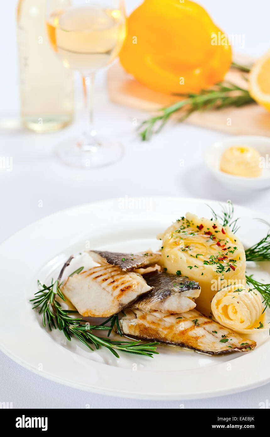 baked fish with potatoes,rosemary and spices Stock Photo - Alamy