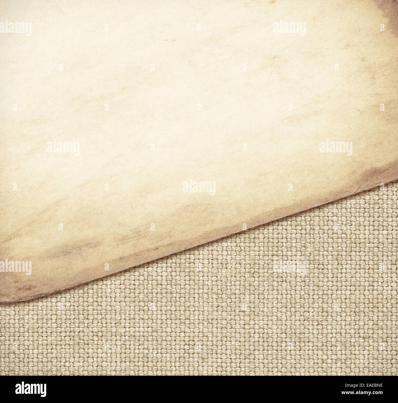 Brown paper texture on light burlap fabric Stock Photo - Alamy