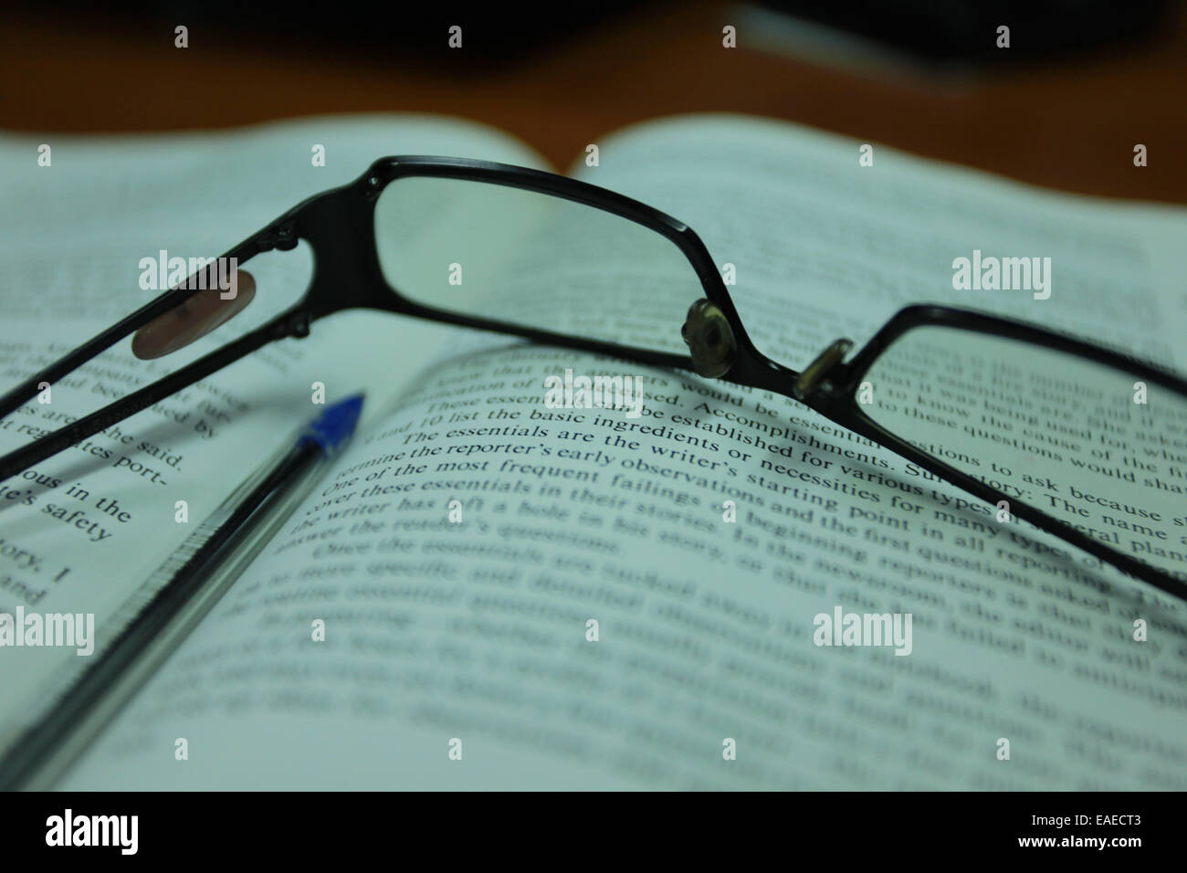 Reading glasses on an open book Stock Photo - Alamy