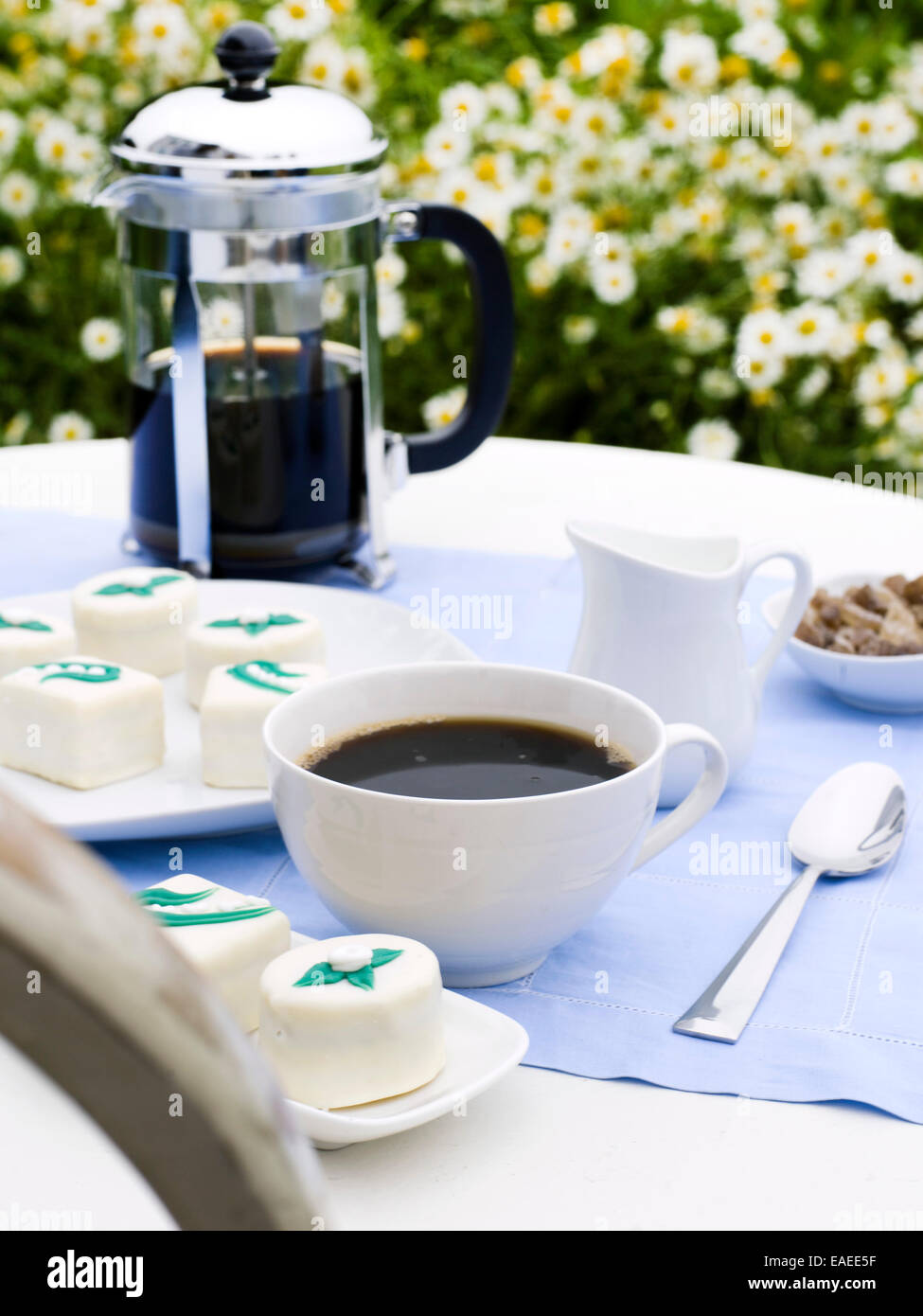 serving of coffee and sweets garden side Stock Photo - Alamy