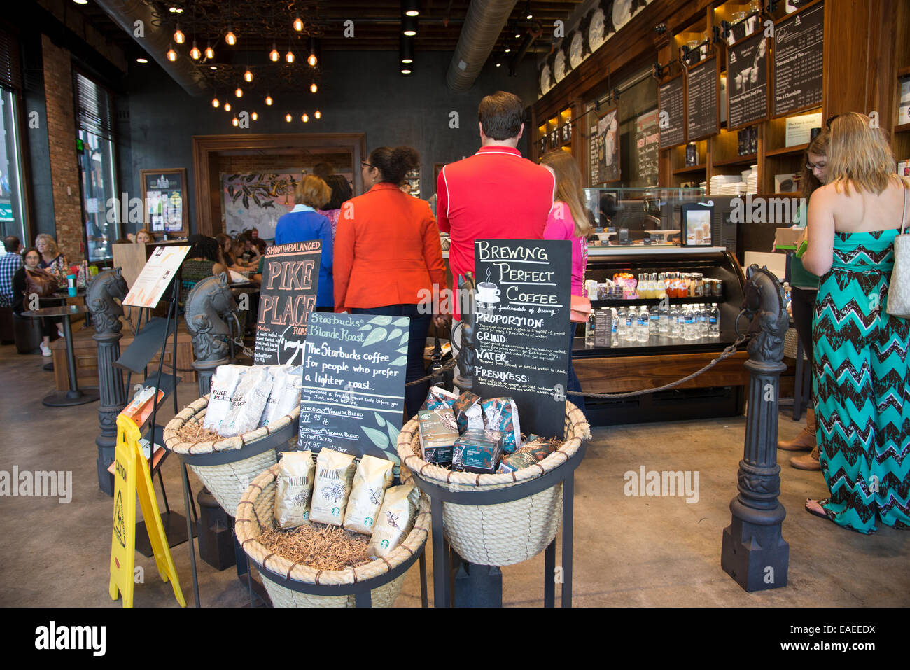 Customers wait in line Starbucks coffee shop in New Orleans USA Stock ...