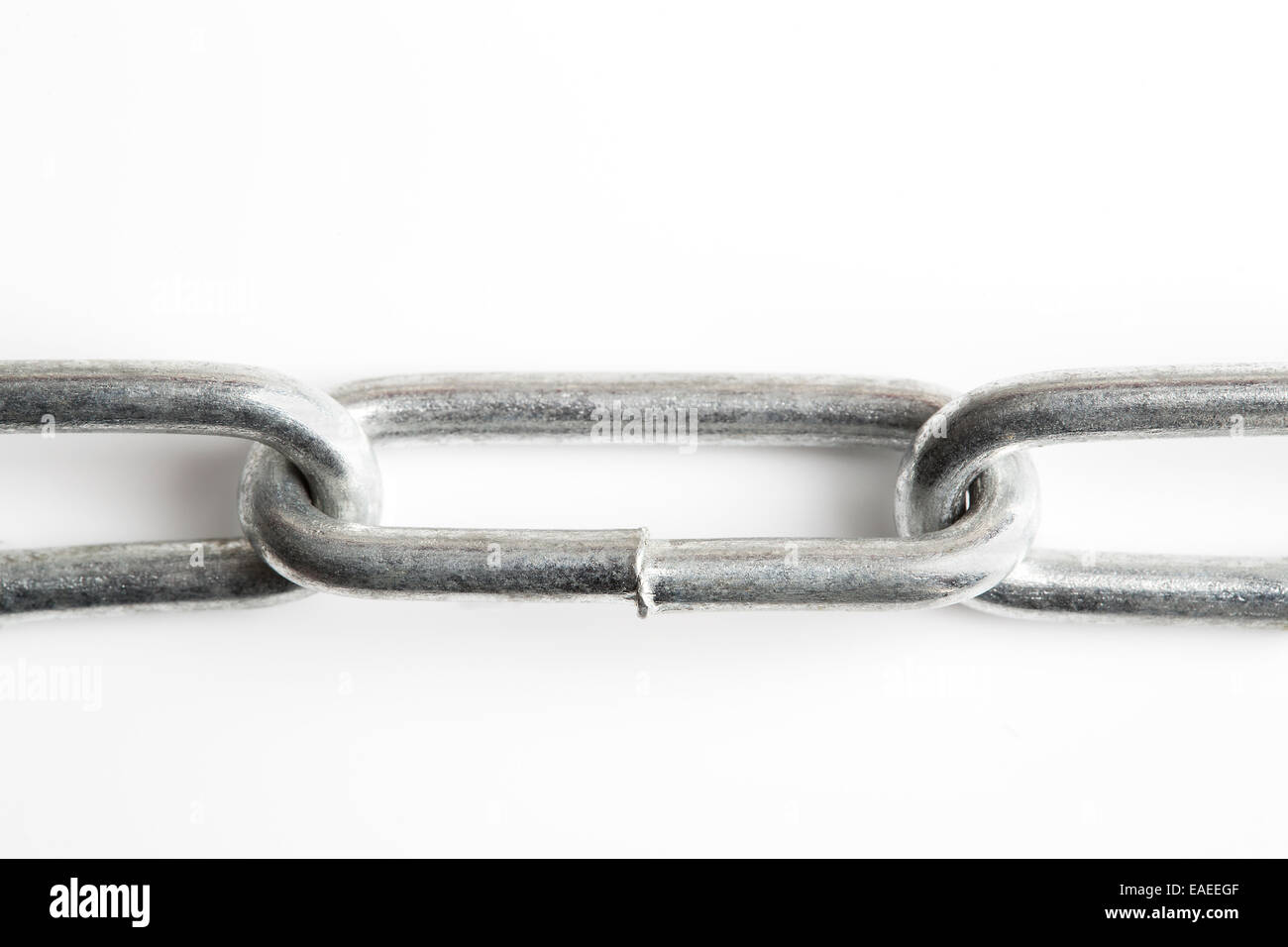 Closeup of silver chains in front of a white background Stock Photo - Alamy