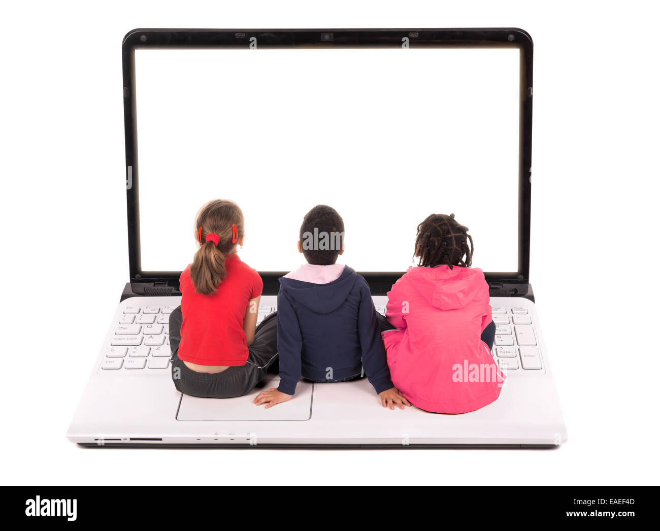 Group of young children in a laptop computer keyboard looking at the ...