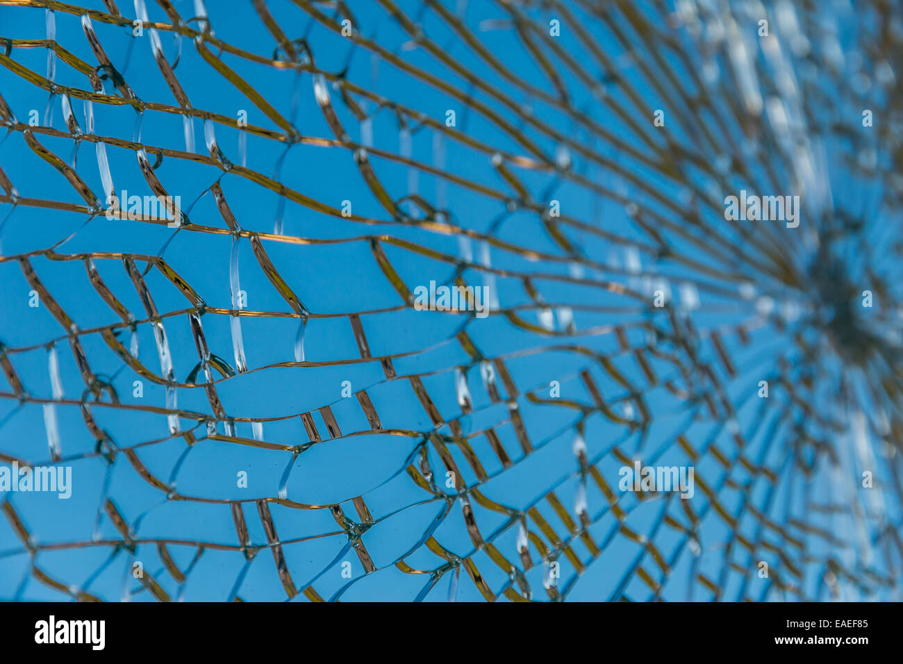 smashed window glass of home under secured premises creating a security ...