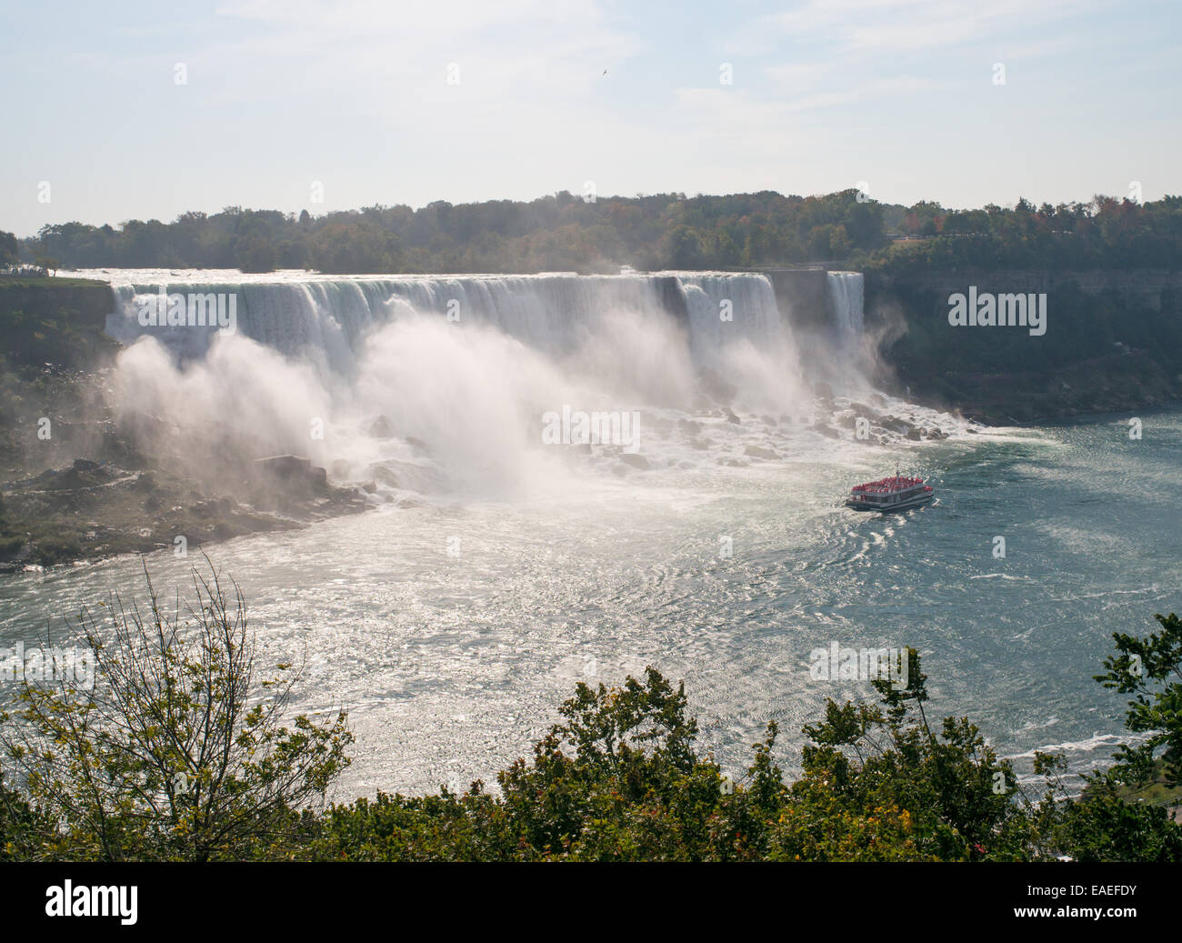 Tourist boat "Hornblower" sailing close to American Falls, Niagara ...