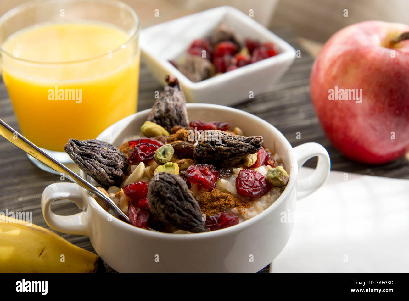 Fresh fruit and oatmeal with nuts and fruit toppings for breakfast ...