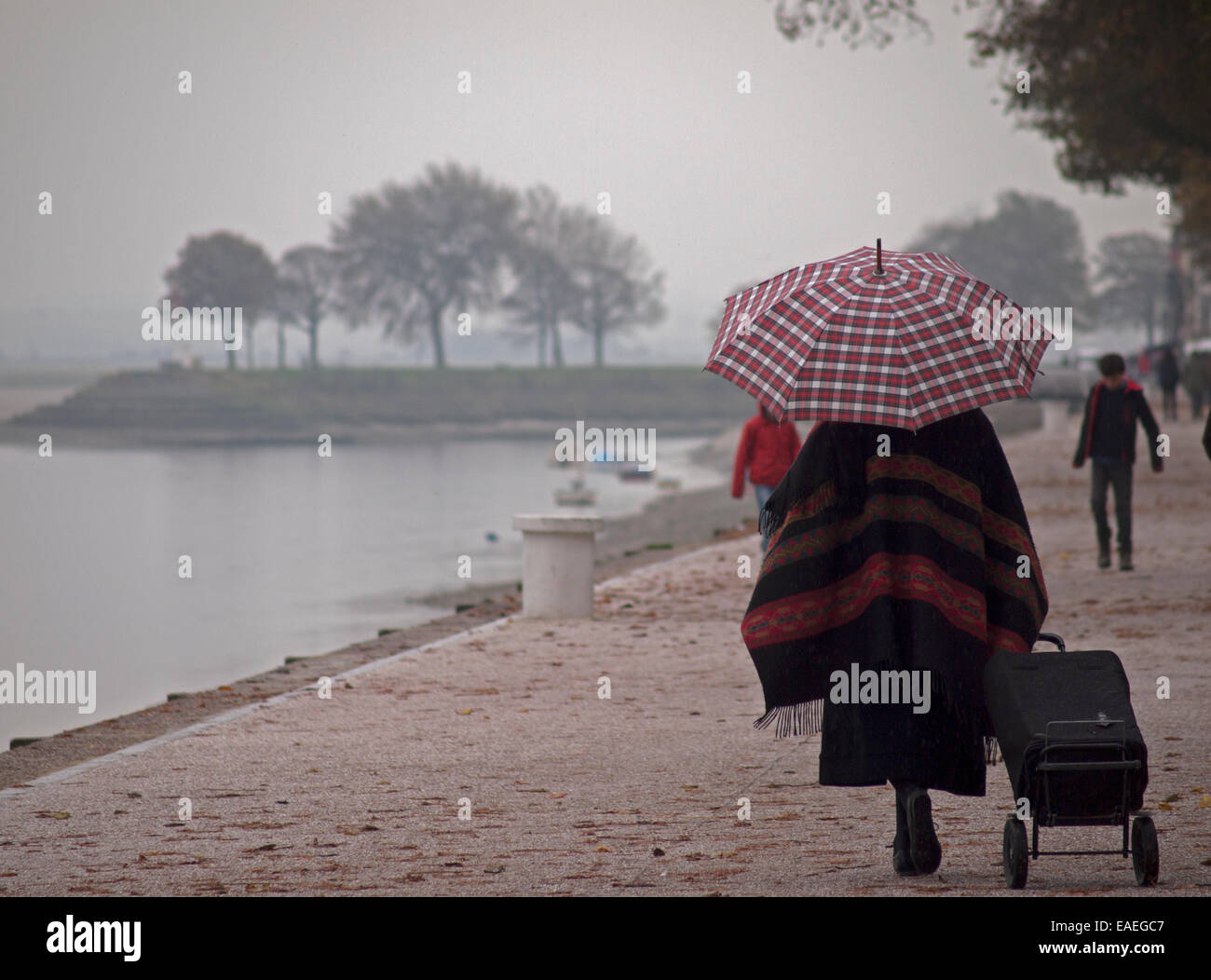 Promenading along the waterside boardwalk in Saint-Valery-sur-Somme ...