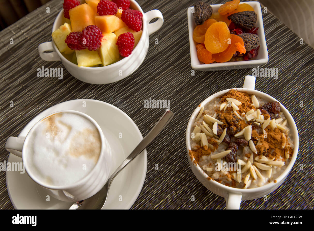 Fresh fruit and oatmeal with nuts and fruit toppings for breakfast ...