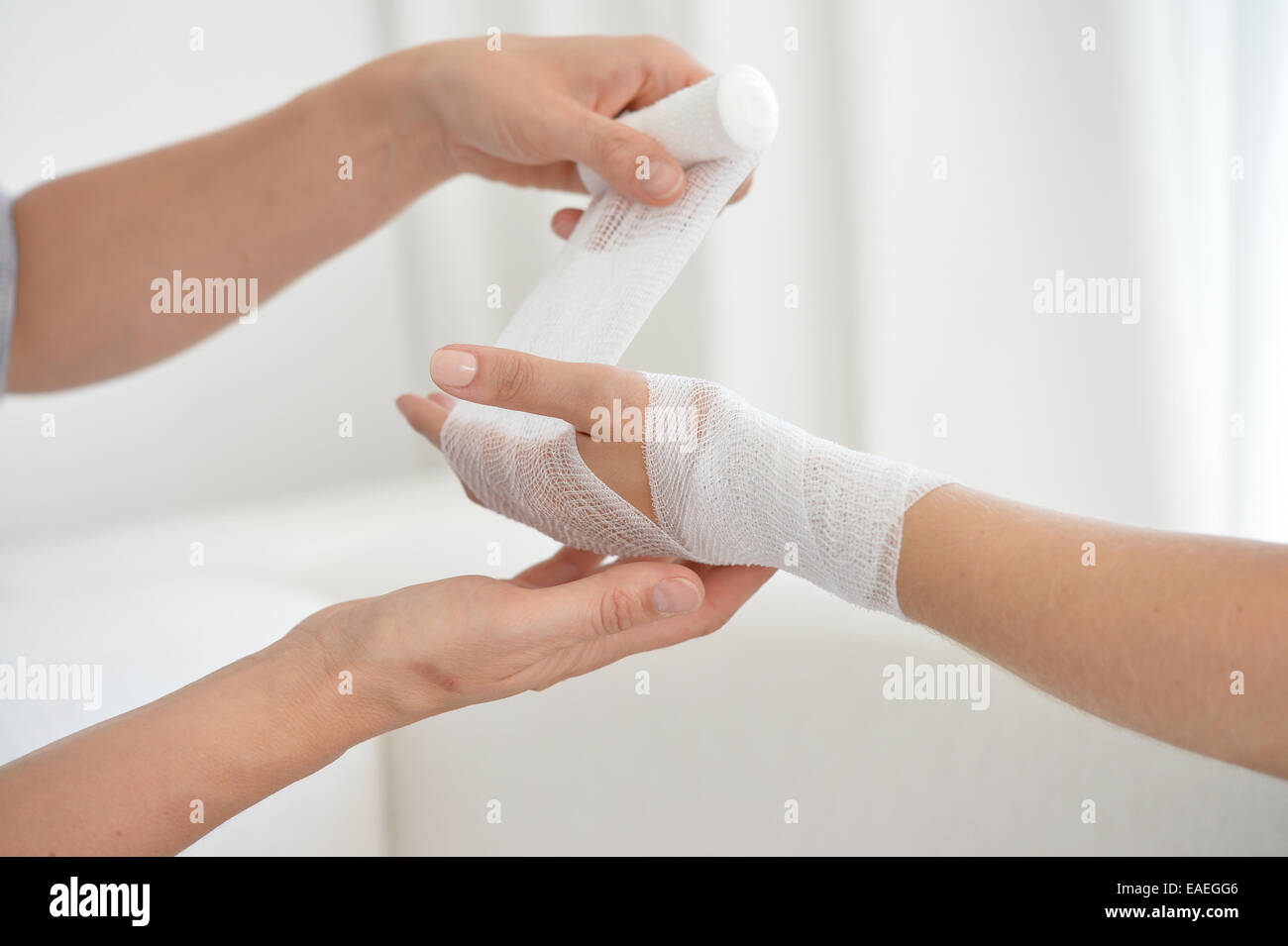 Woman puts a bandage on hi-res stock photography and images - Alamy