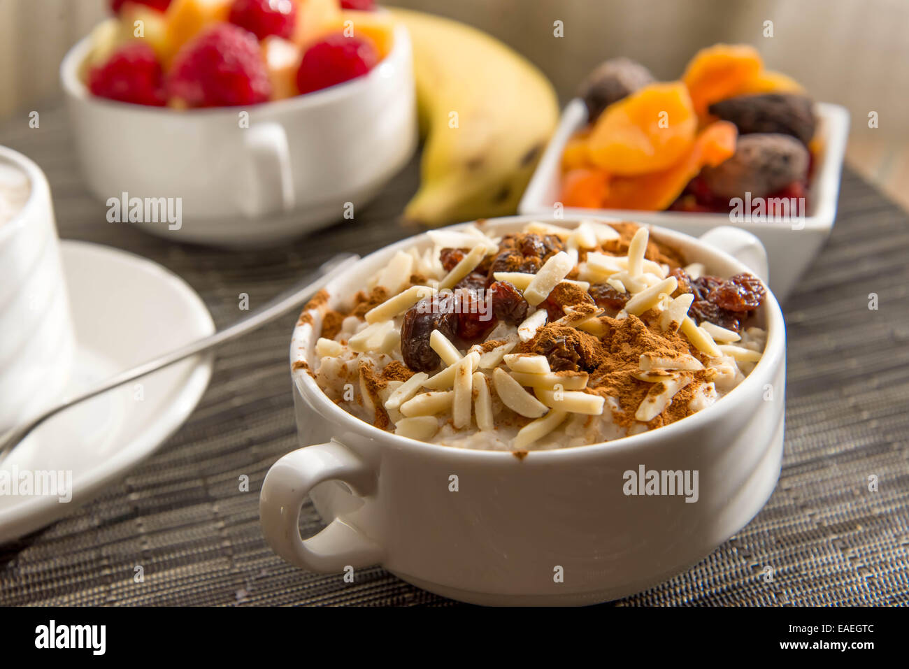 Fresh fruit and oatmeal with nuts and fruit toppings for breakfast ...