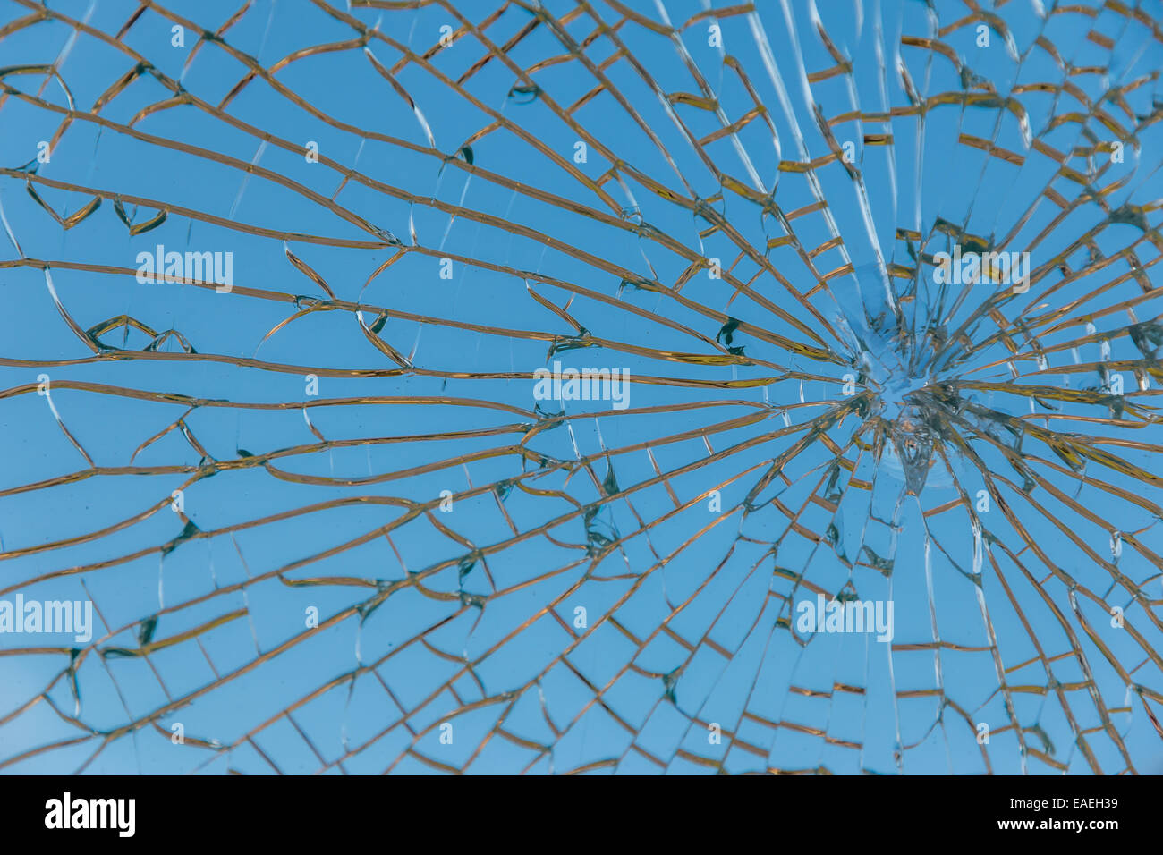 smashed window glass of home under secured premises creating a security ...