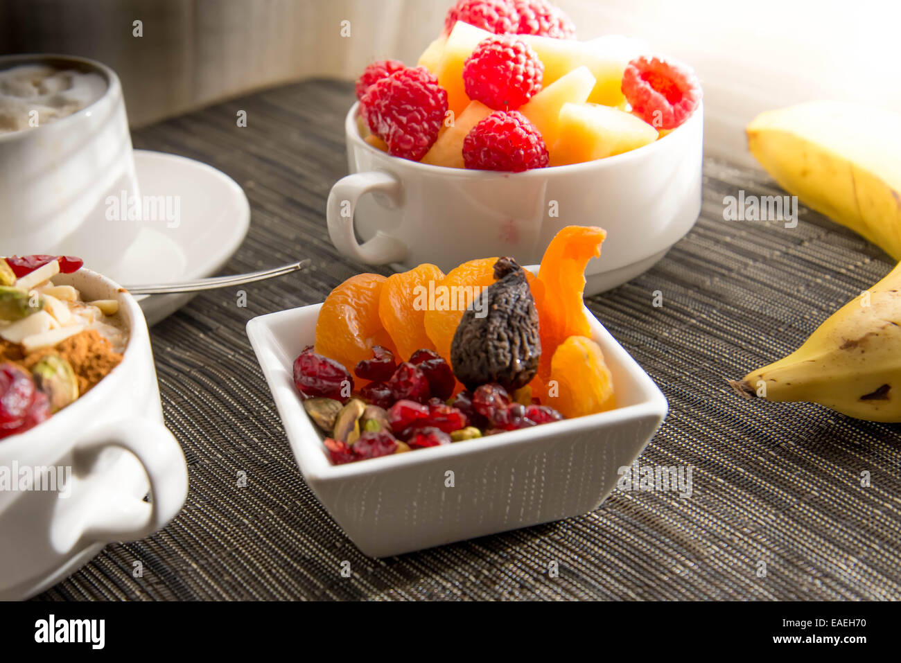 Fresh fruit and oatmeal with nuts and fruit toppings for breakfast ...