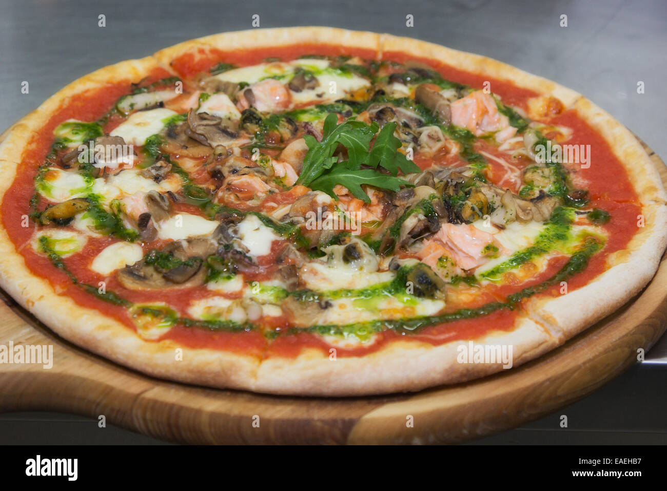 pizza with mussels in tomato sauce Stock Photo - Alamy