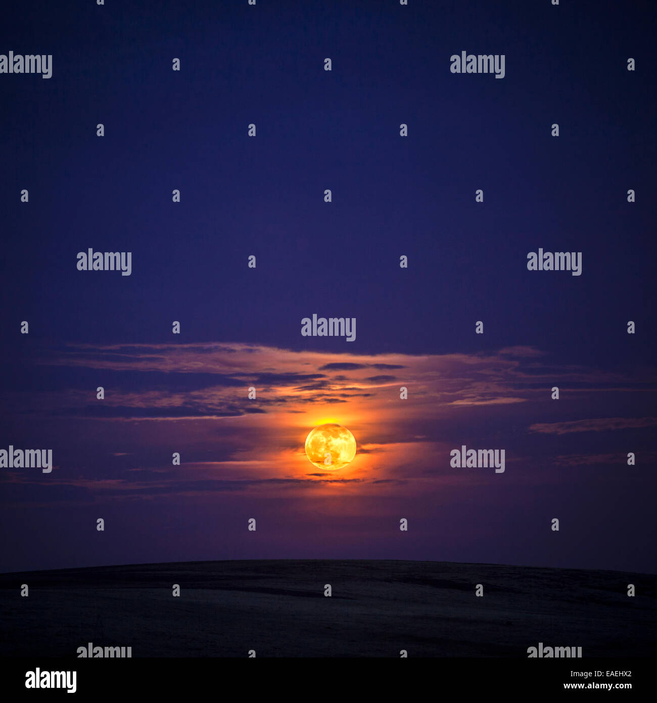 Blood Moon rising over a hill Stock Photo - Alamy