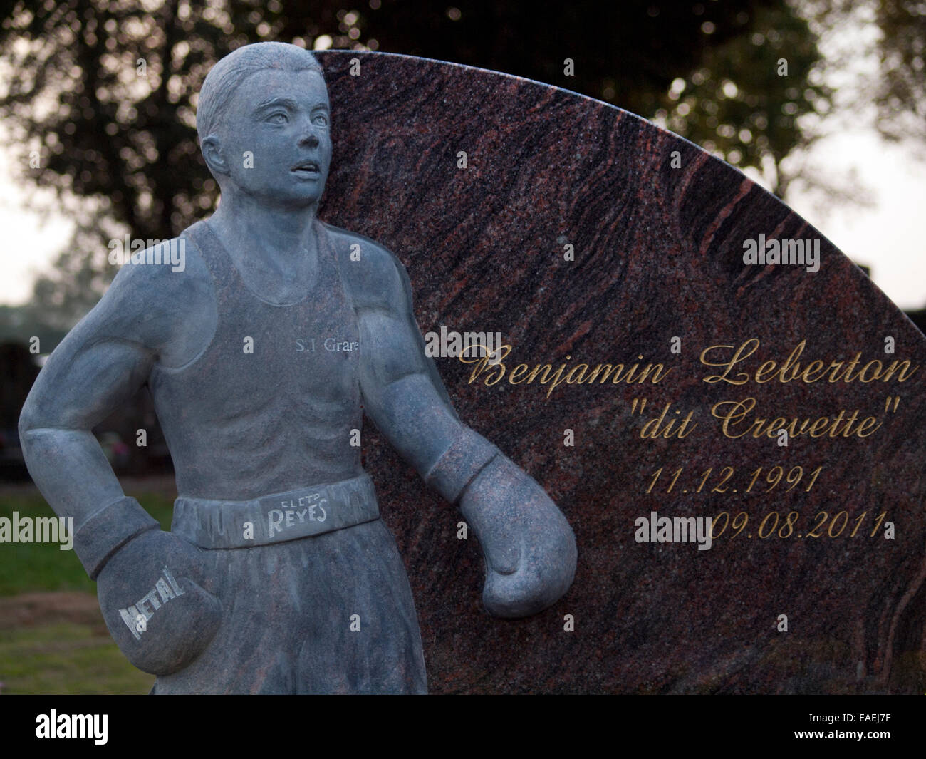 The carved gravestone of a young boxer in a cemetery in Abbeville ...