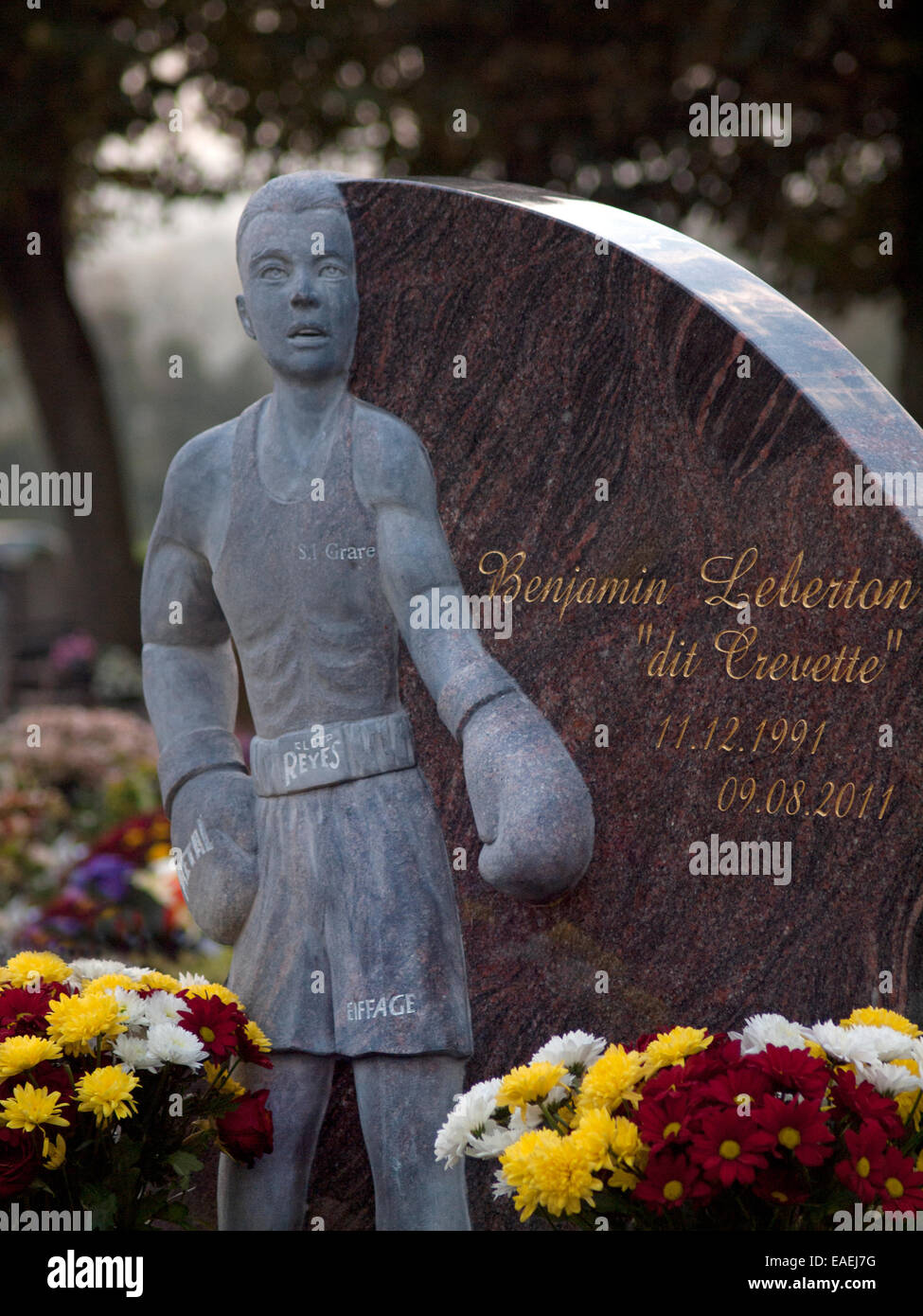 The carved gravestone of a young boxer in a cemetery in Abbeville ...