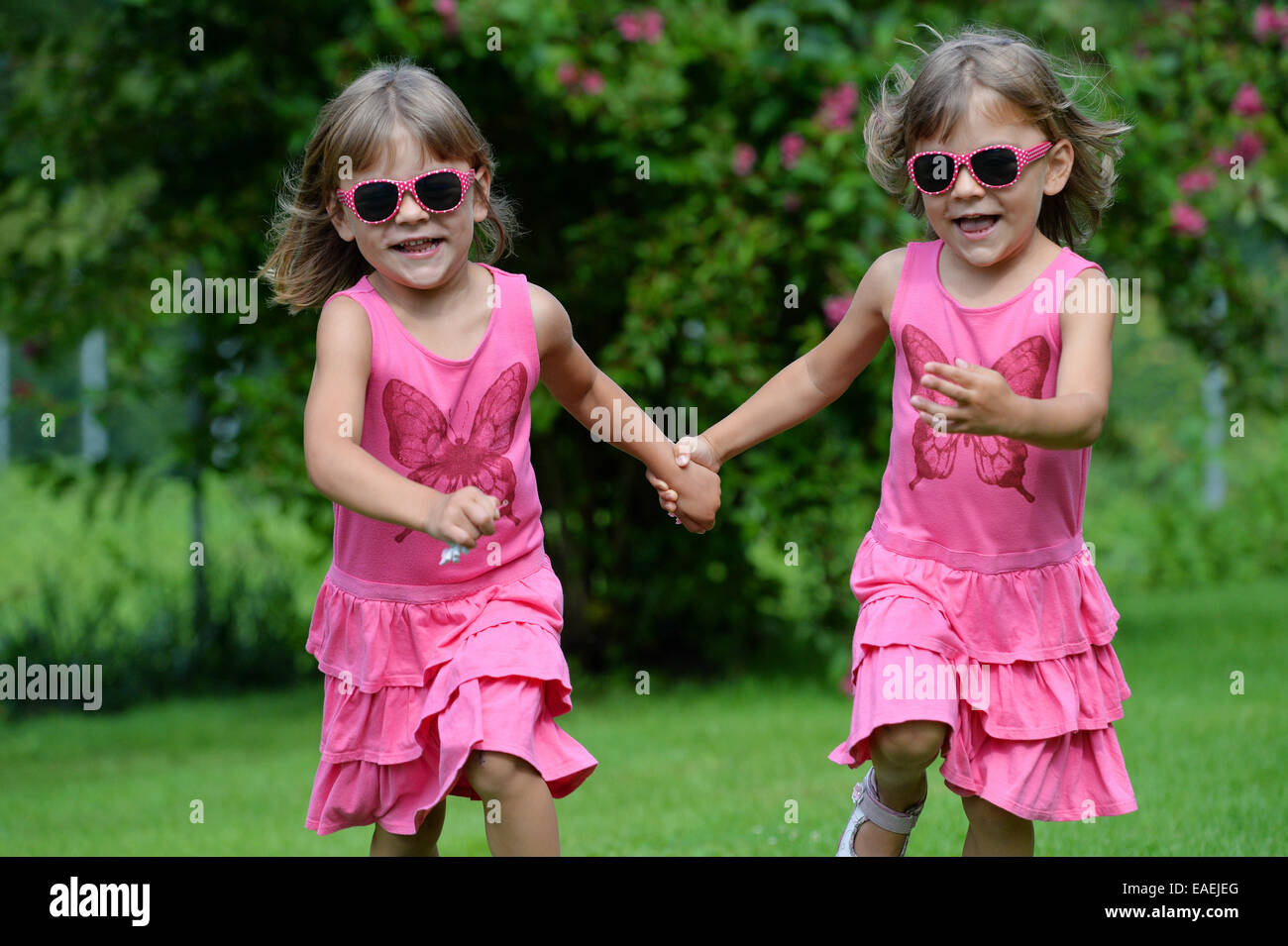 Twins, girls Photo: Frank May Stock Photo - Alamy