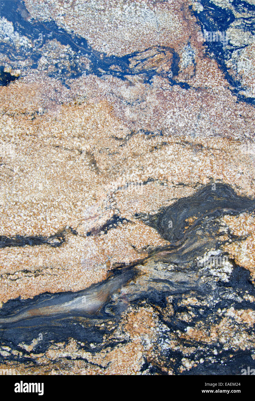 A full slab of cut and polished Granite makes a background of textures ...