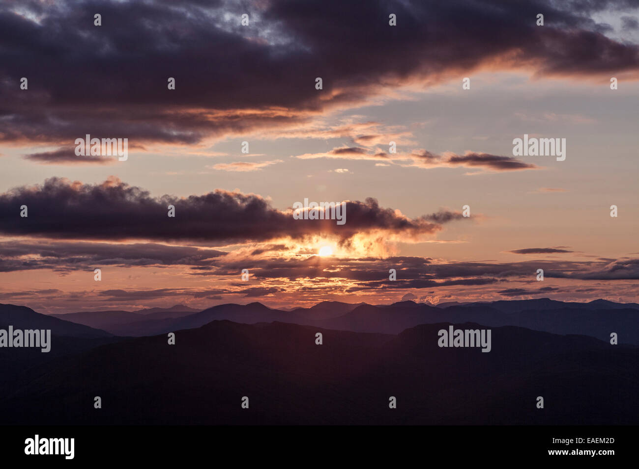 Sunset over a mountain range Stock Photo - Alamy