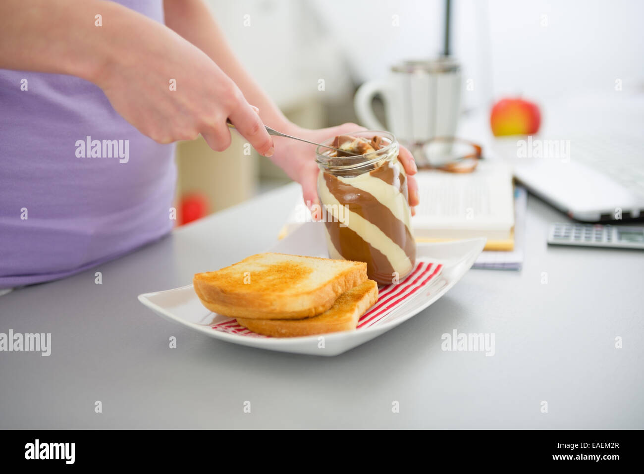 Woman toast chocolate spread hi-res stock photography and images - Alamy