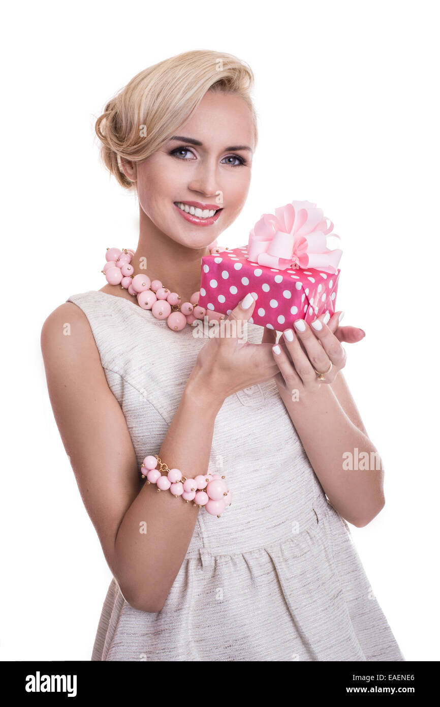 Young beautiful woman holding small gift box with ribbon. Studio ...