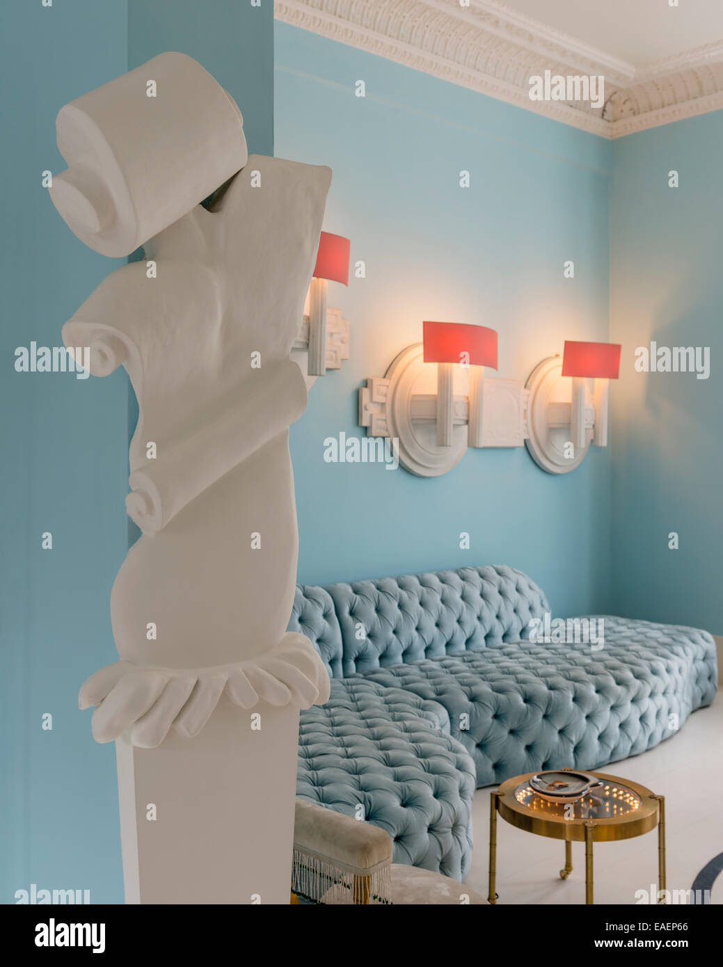 Plaster work detail in living room with velvet buttoned sofa designed ...