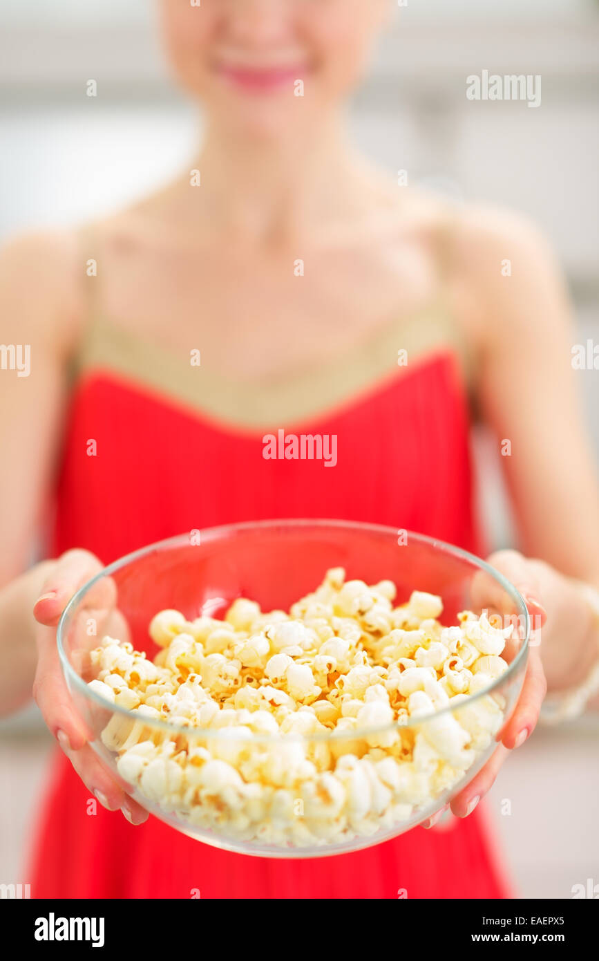 Closeup on young woman giving popcorn Stock Photo - Alamy