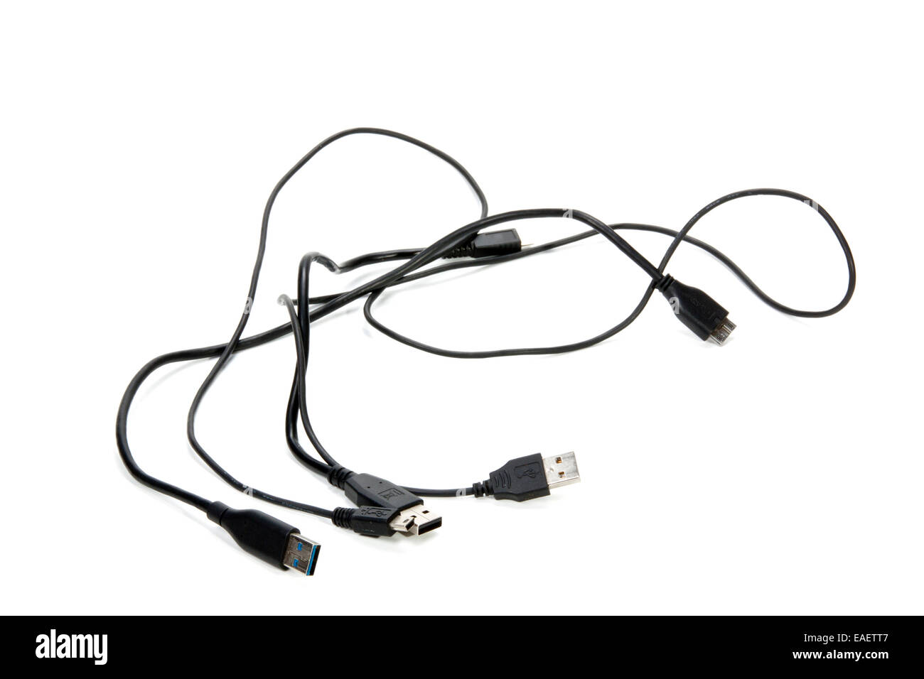 three isolated black intertwined usb cables on white Stock Photo - Alamy
