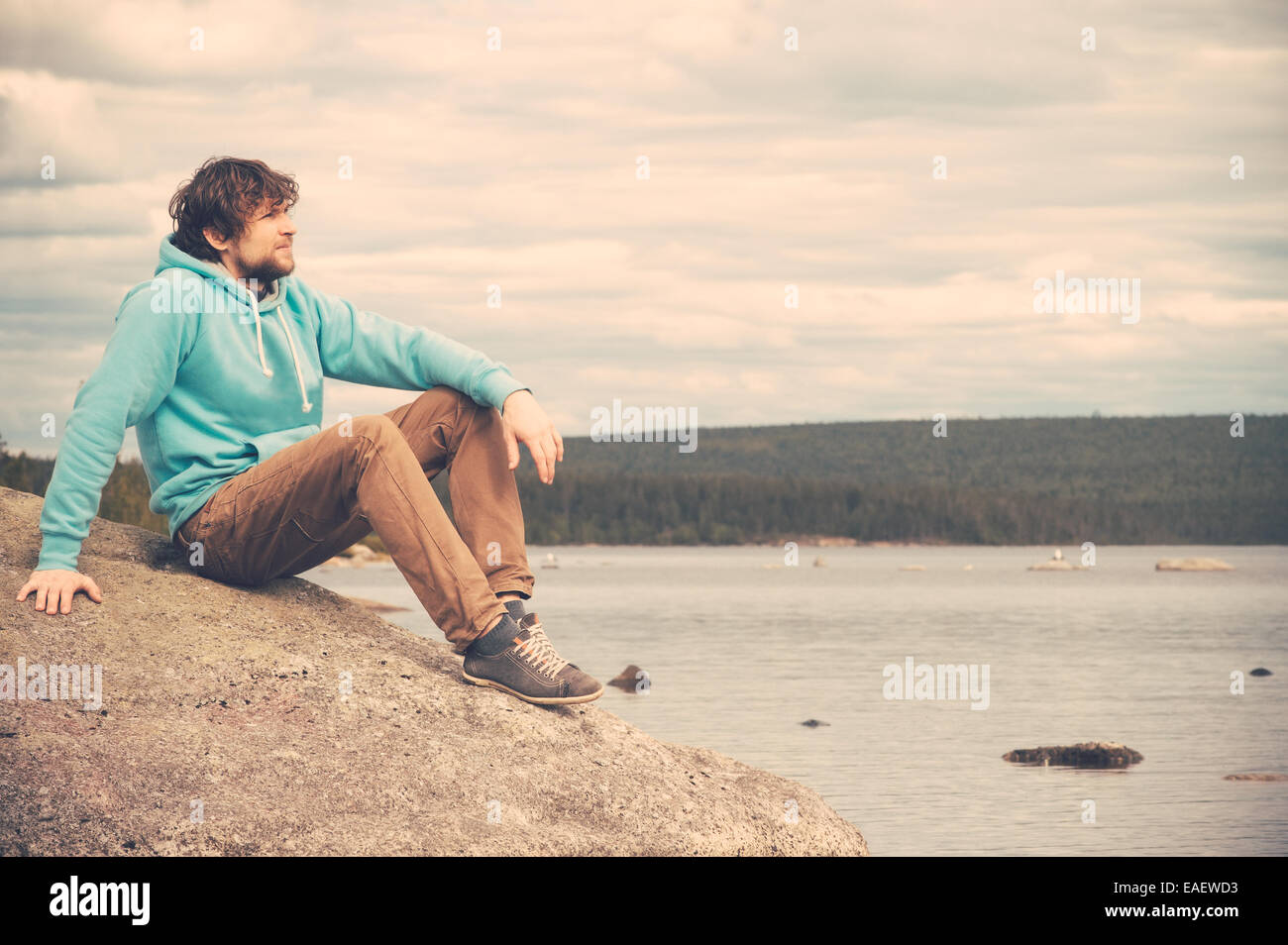 Young Man Traveler relaxing alone outdoor Lifestyle concept with ...