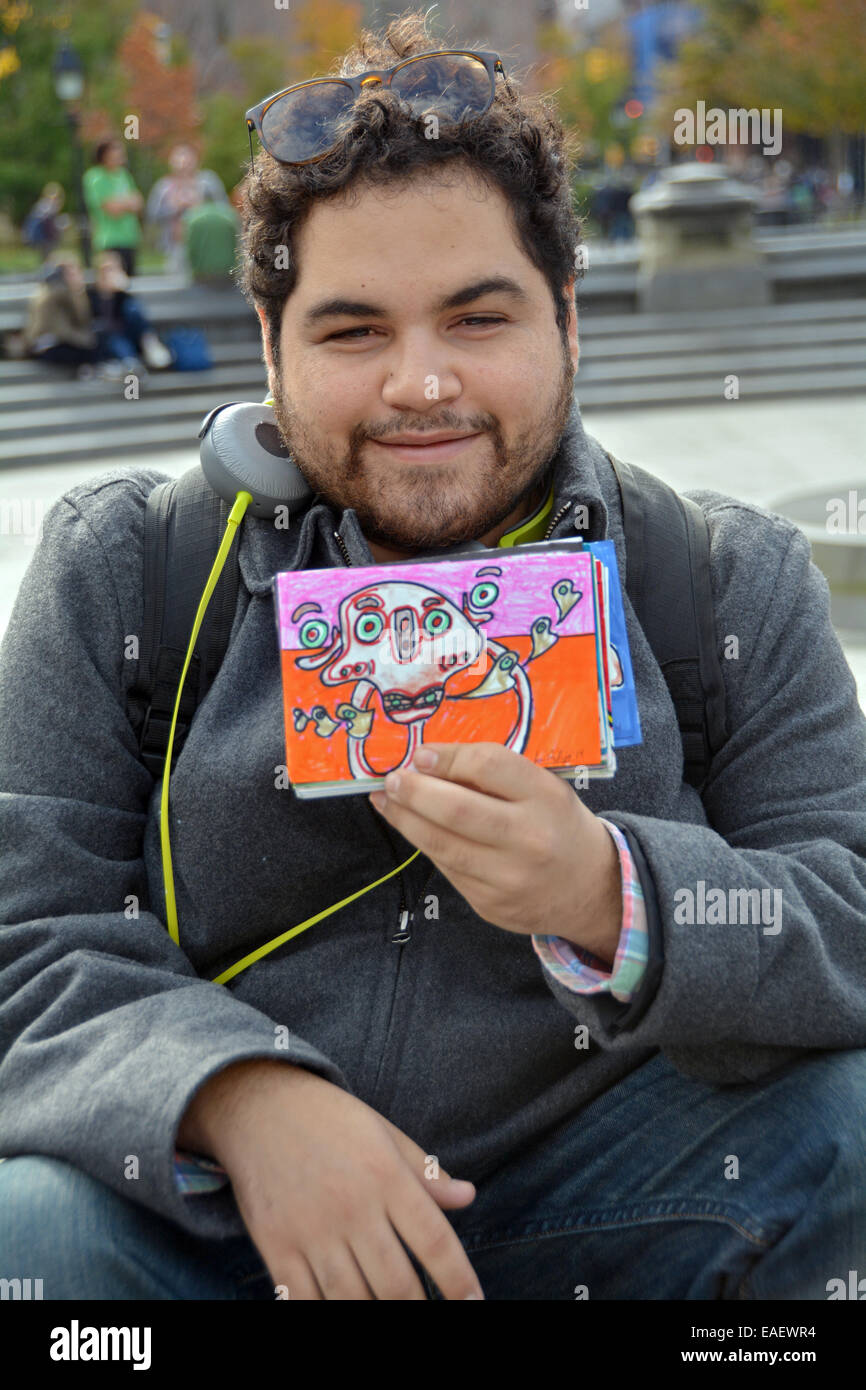 A young man selling handmade postcards at the fountain in Washington ...