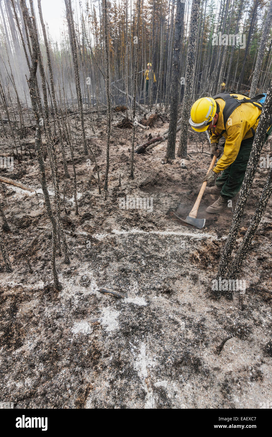Firefighter forest fire axe High Resolution Stock Photography and ...