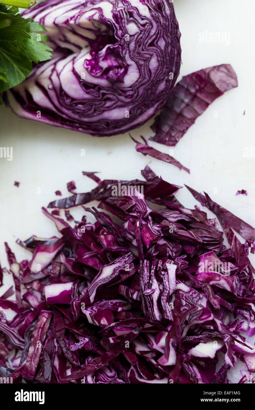 Cut red cabbage on simple white background Stock Photo - Alamy
