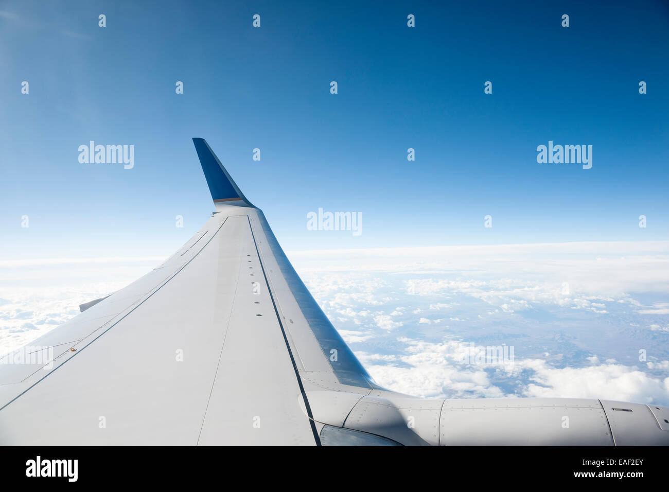 Wing tip above clouds Stock Photo - Alamy