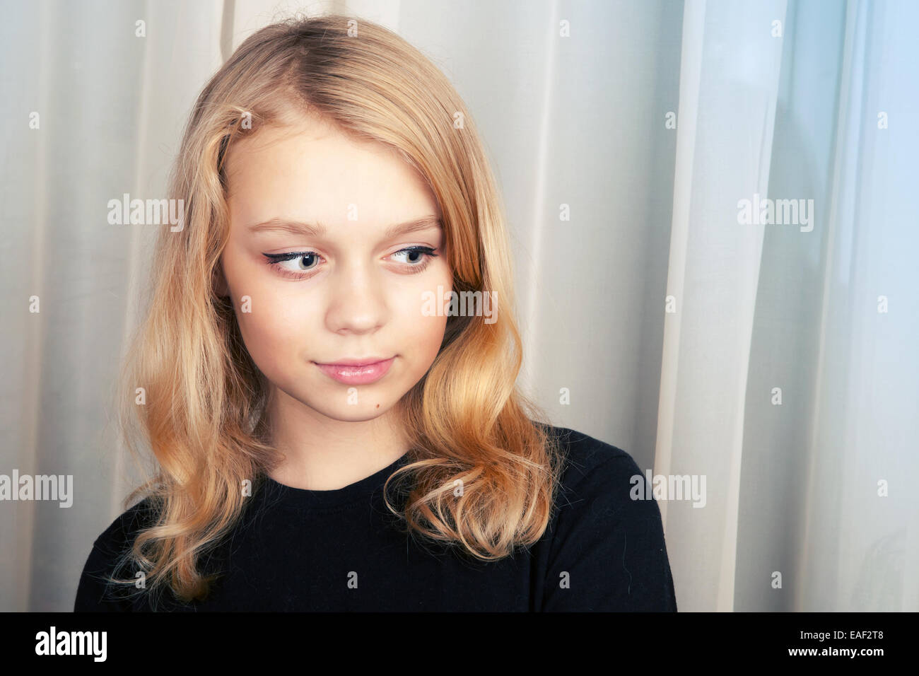 Smiling blond Caucasian girl, close up studio portrait Stock Photo - Alamy