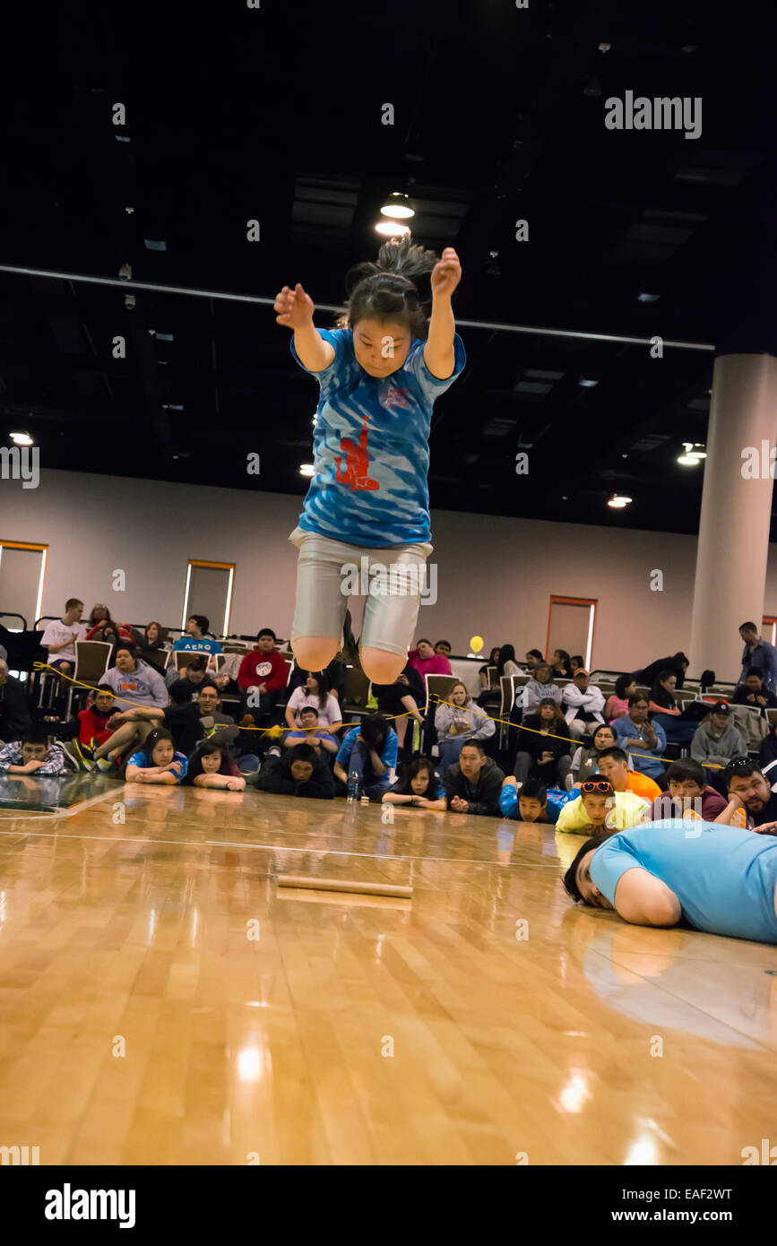 Athlete in mid air in Girl's Toe Kick competition, Dena'ina Civic ...