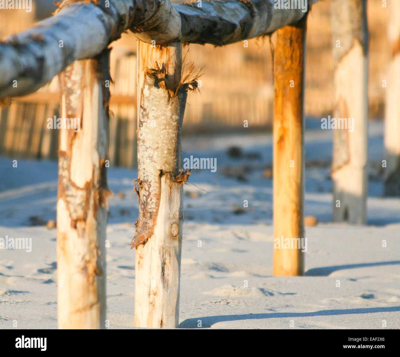 Artistic Sunrise Fence on the beach Stock Photo - Alamy