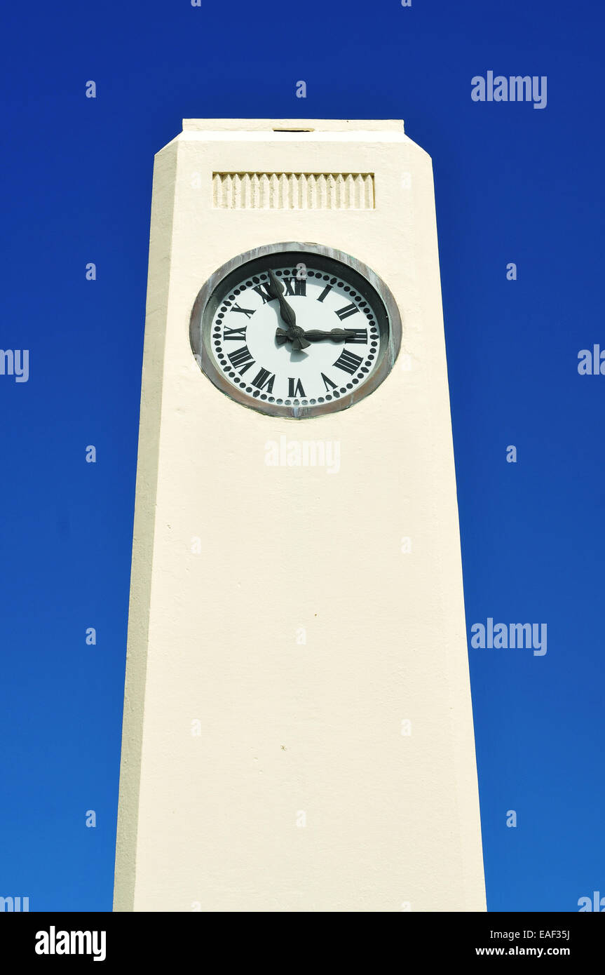 White rectangle pillar-shaped monument with clock at top Stock Photo ...