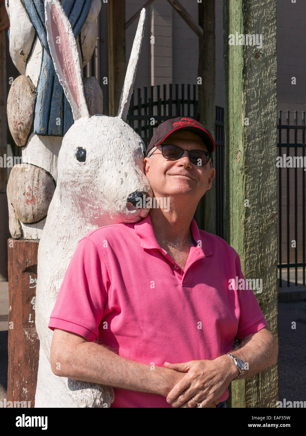 Senior Man posing with Large Carved Rabbit, Wall Drug Backyard , South ...