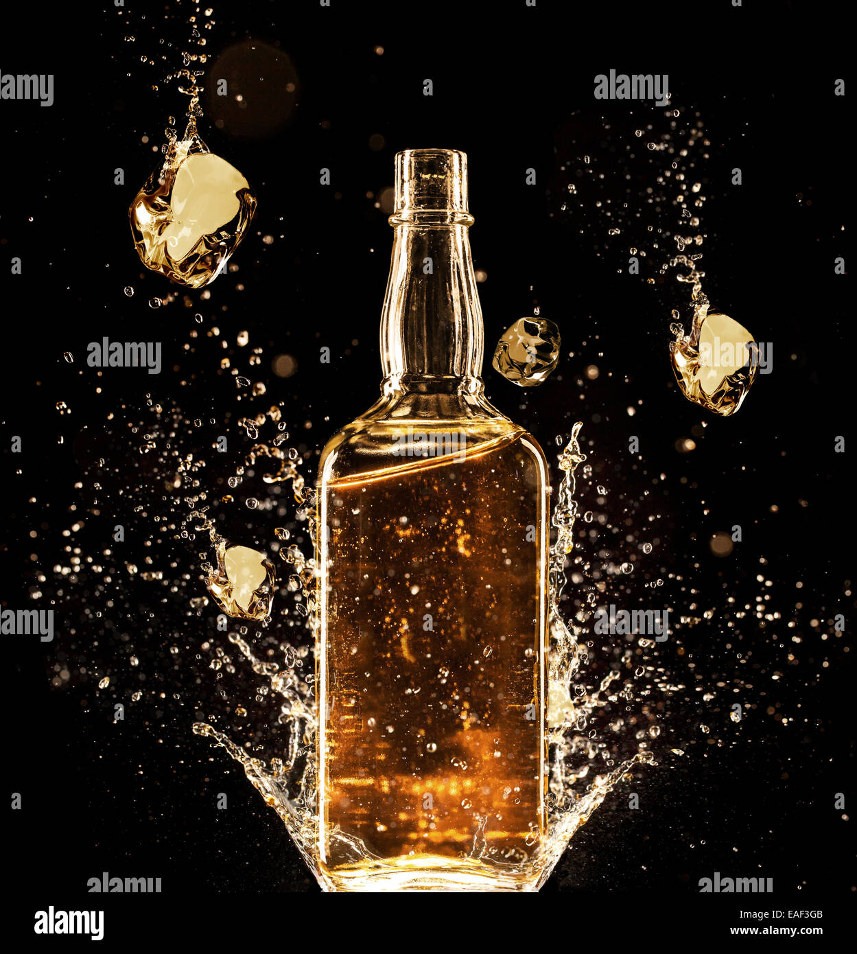 Concept of liquor splashing around bottle, isolated on black background ...