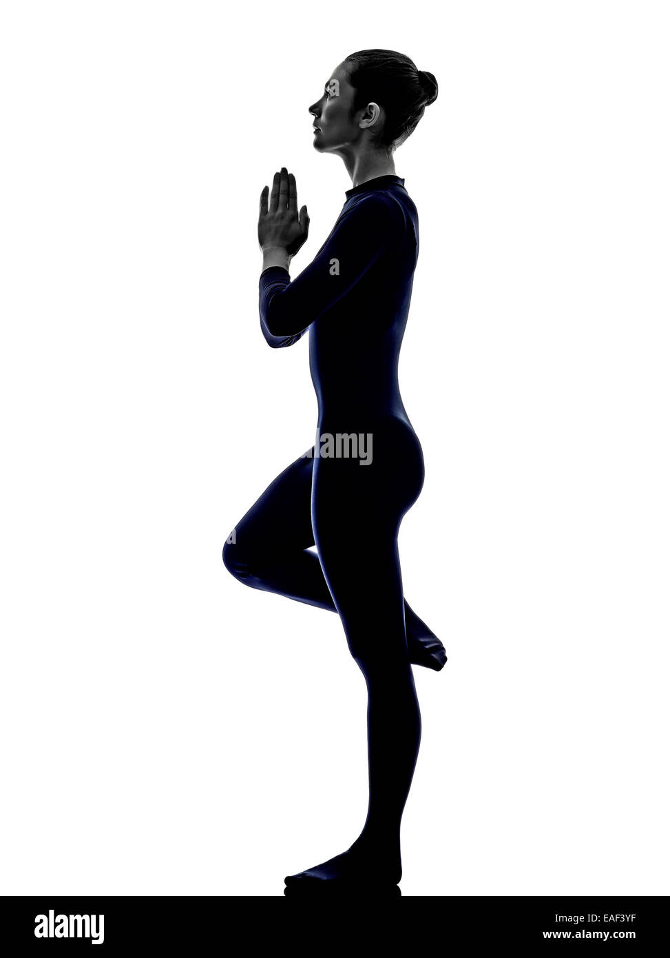 woman exercising Vrksasana tree pose yoga silhouette shadow white ...