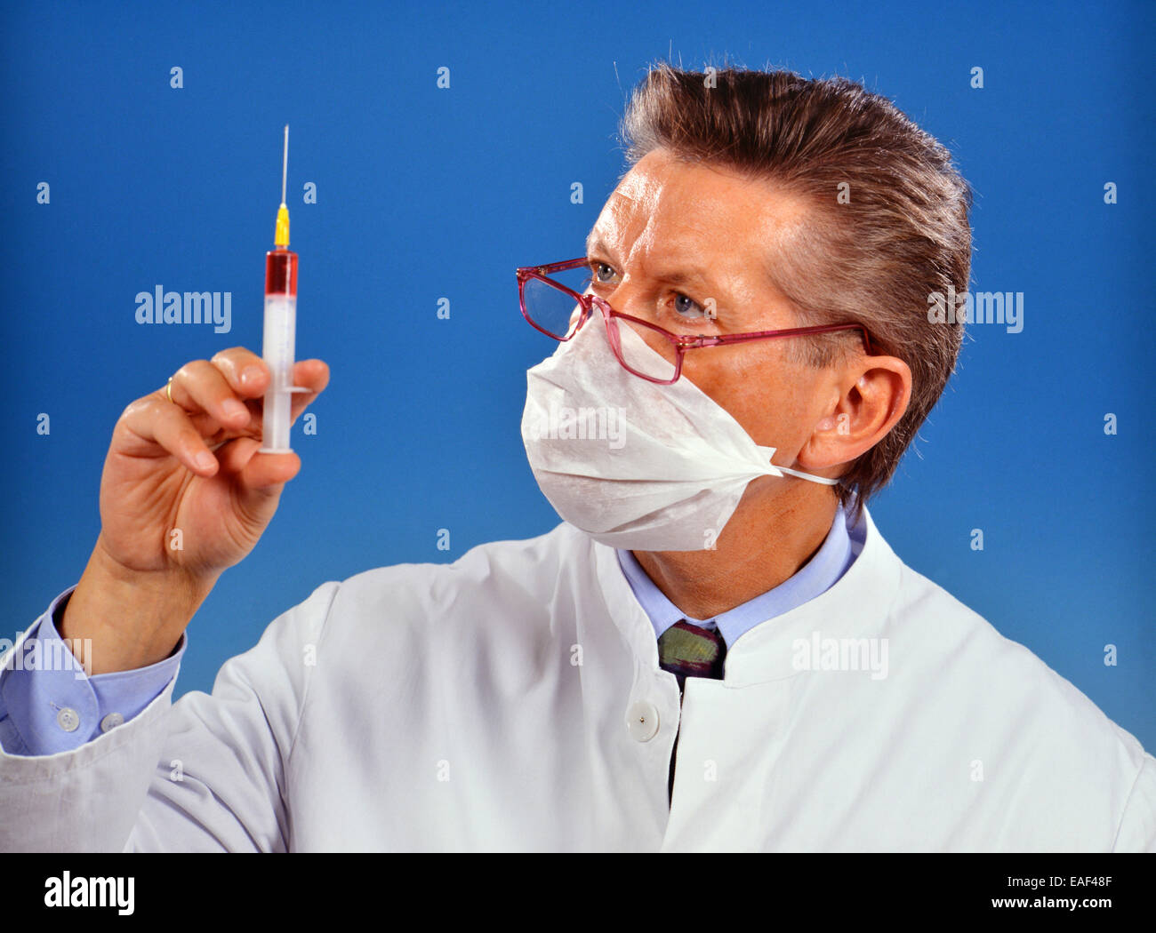 Doctor with Injection Stock Photo - Alamy