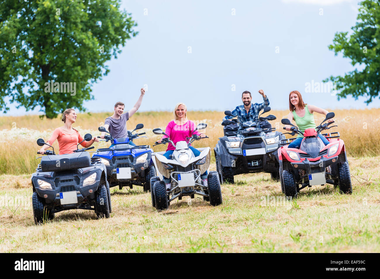 Friends driving off-road with quad bike or ATV Stock Photo - Alamy