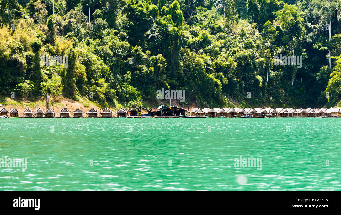 Small bungalow made of bamboo floating. Surrounded by mountains and ...