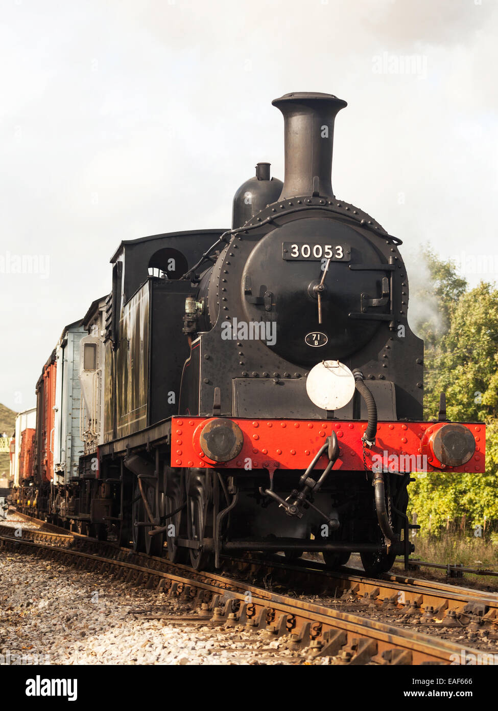 Steam engine driving through countryside Stock Photo - Alamy